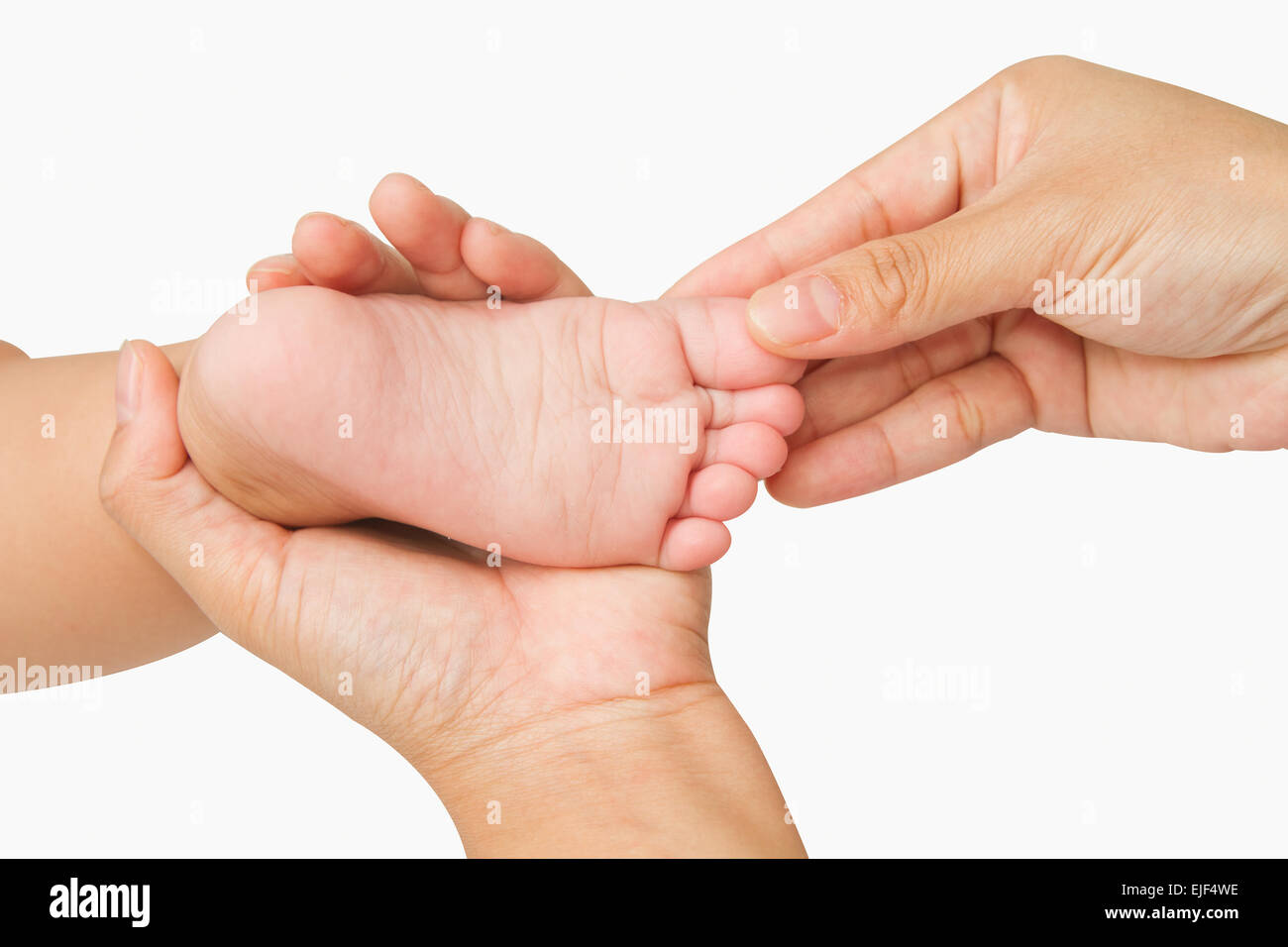 mother massaging little baby's foot Stock Photo - Alamy