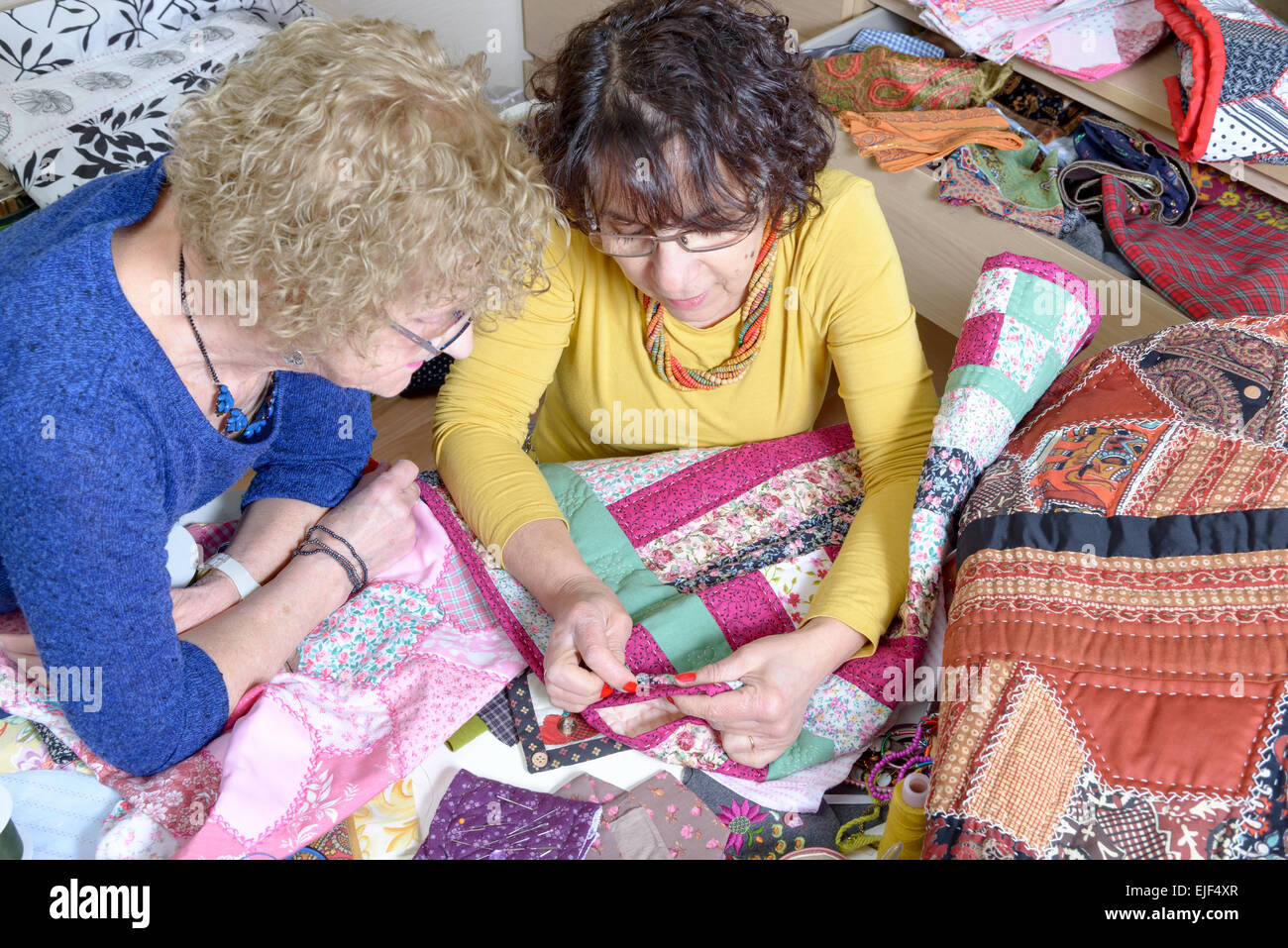 two women working on their patchwork in the workshop Stock Photo - Alamy
