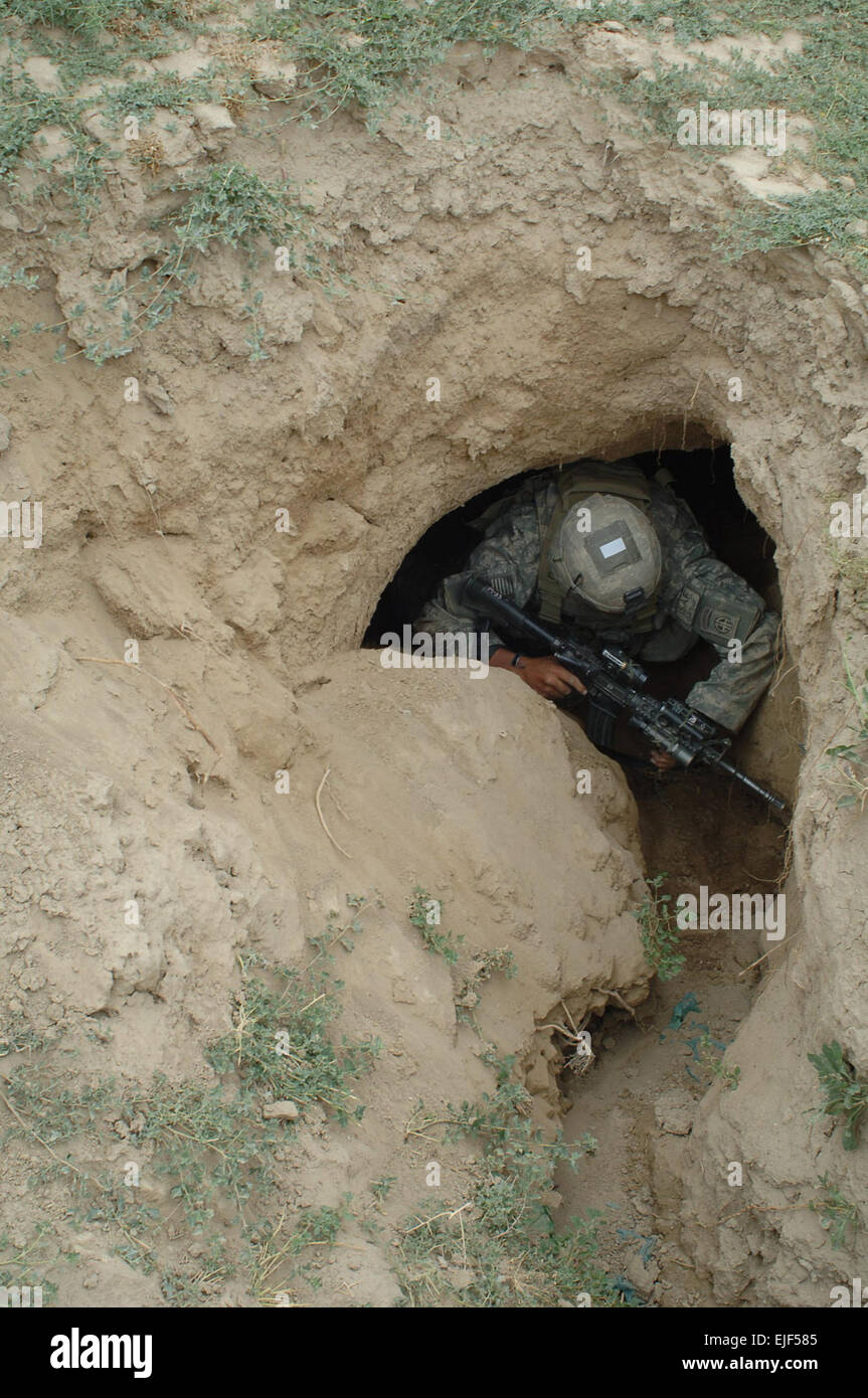 U.S. Army Spc. William Fowler enters a cave during operations near the ...