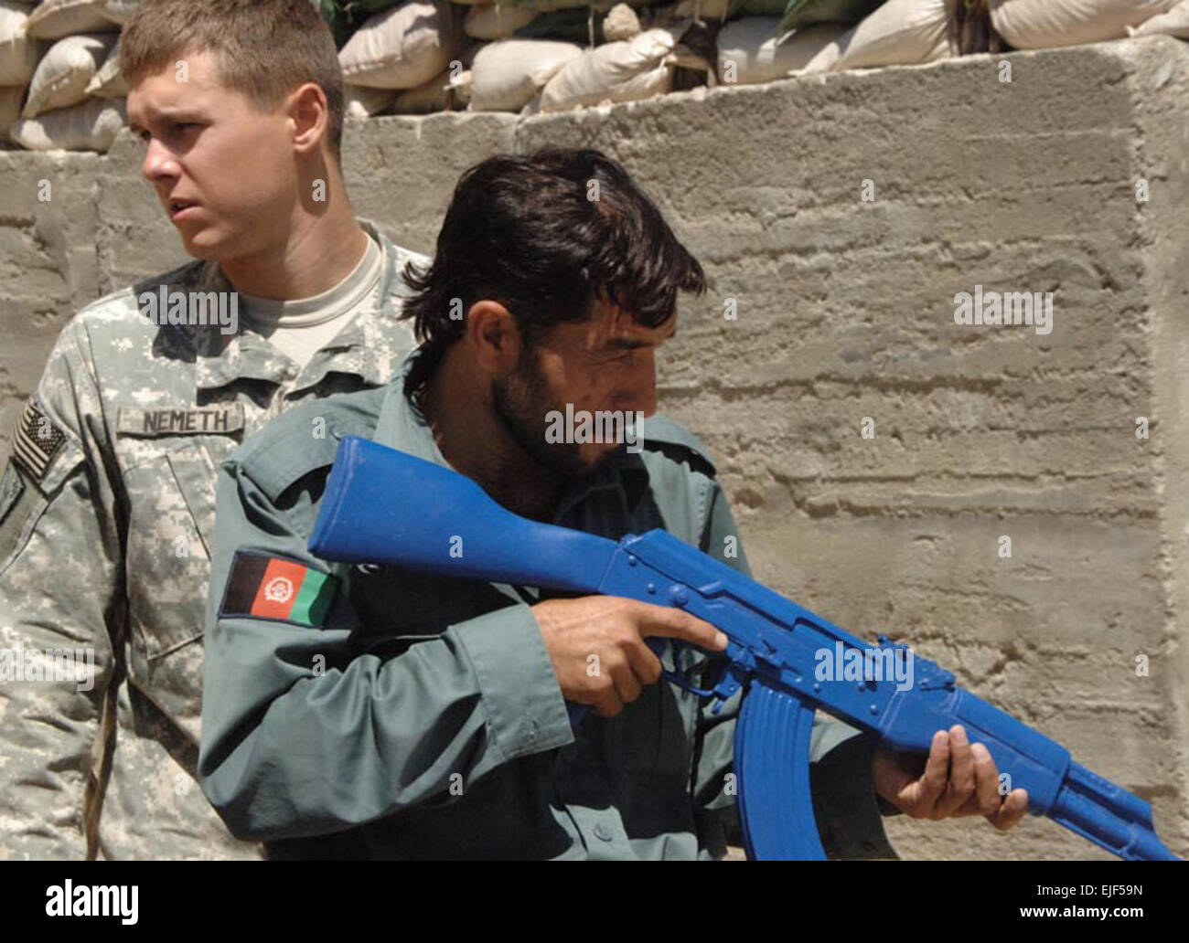 U.S. Army Spc. Jeremiah Nemeth supervises an Afghan National Police ...