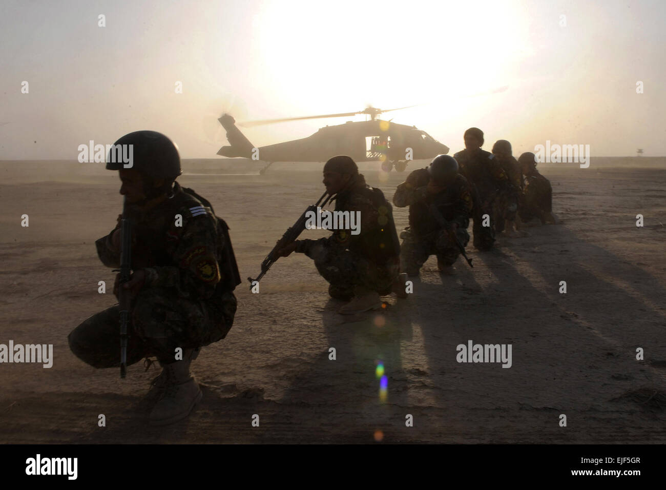 Iraqi policemen, from the Dhi Qar Province pull security during an air ...