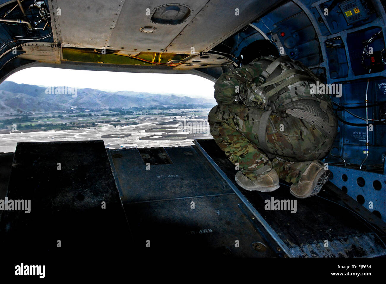 Sgt. Michael Cole, a CH-47 Chinook helicopter flight engineer assigned ...
