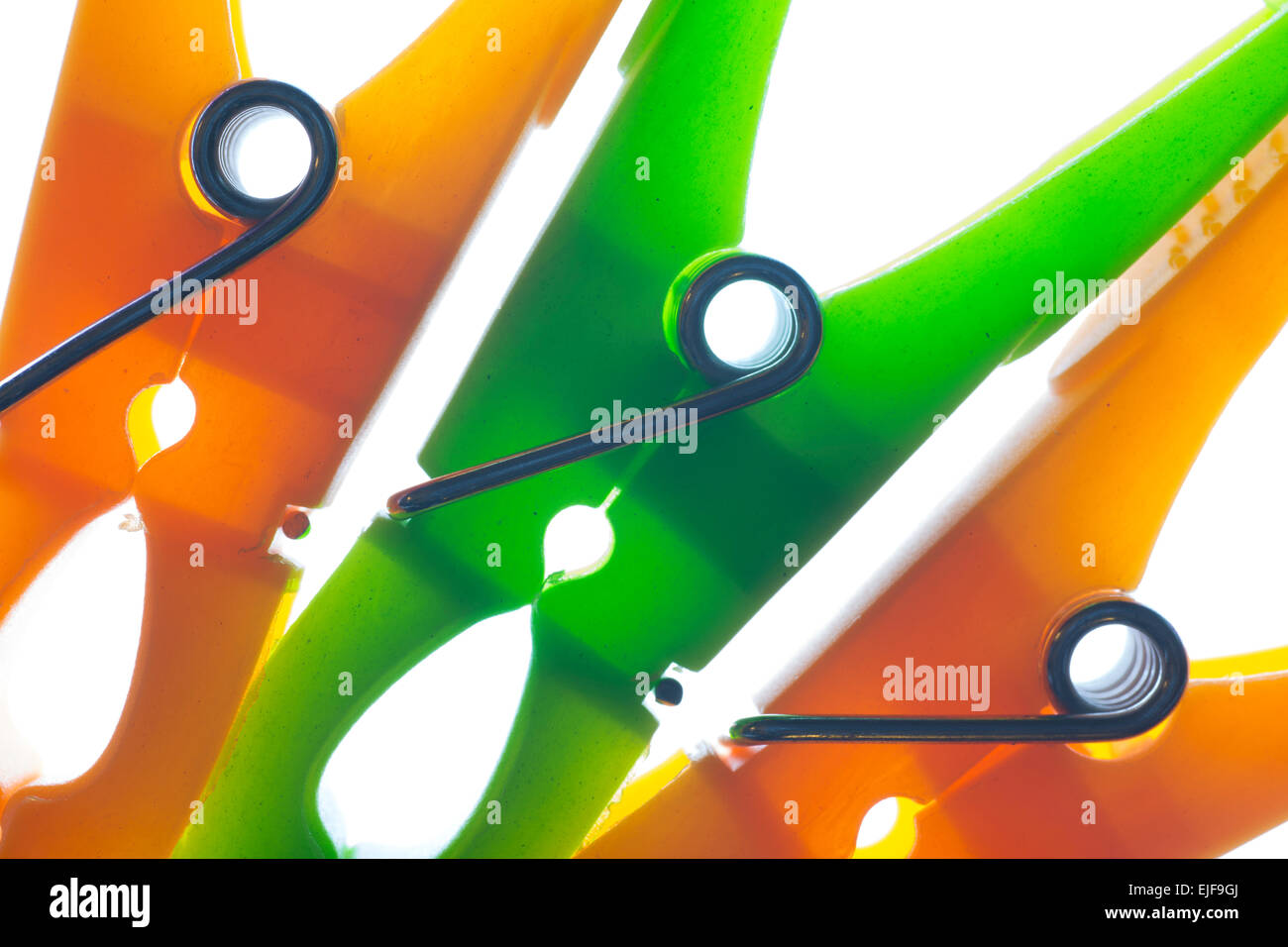 Colourful translucent clothes pegs Stock Photo - Alamy
