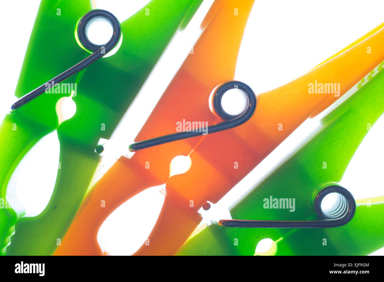 Colourful translucent clothes pegs macro Stock Photo - Alamy