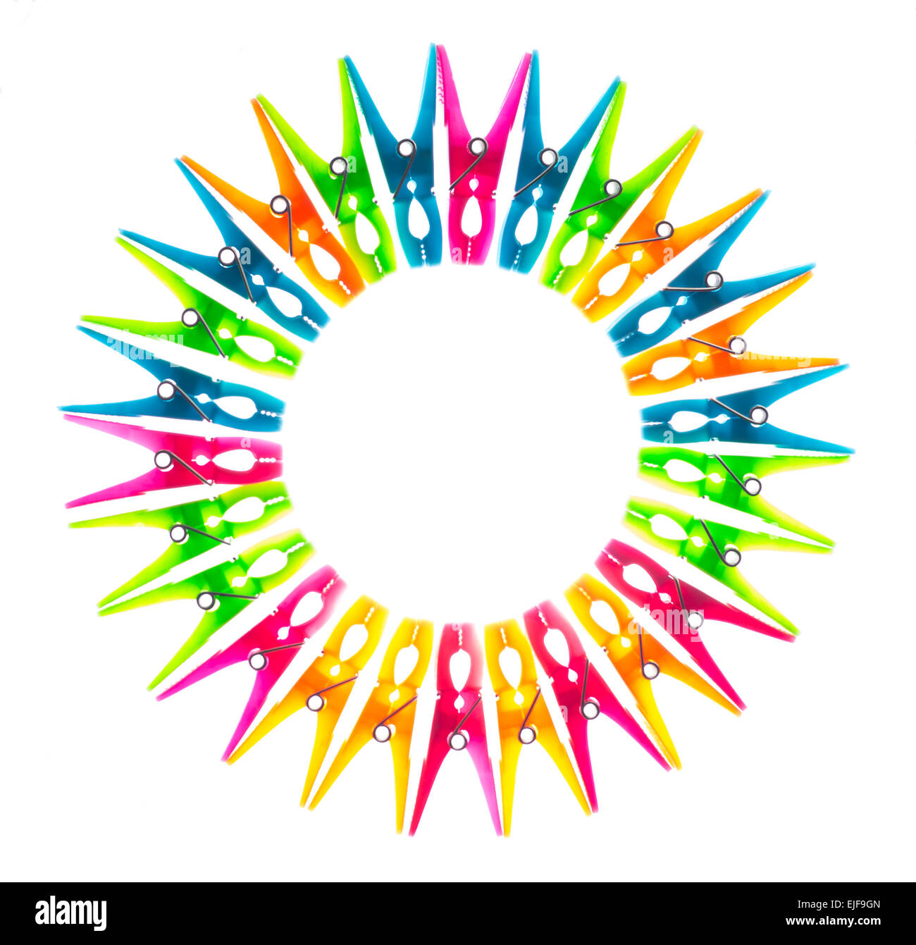 Circle of colourful translucent clothes pegs Stock Photo - Alamy