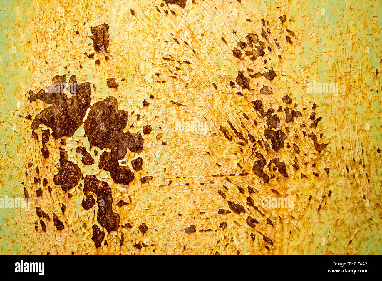 Scratched metal and rust emerges from underneath old paint Stock Photo ...