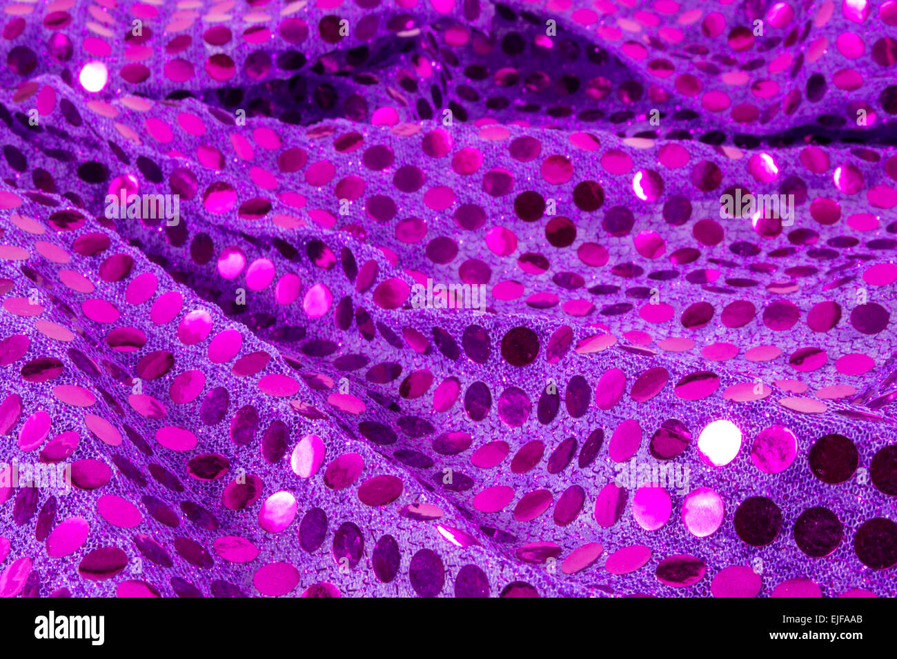 Sequins and purple material close up Stock Photo - Alamy