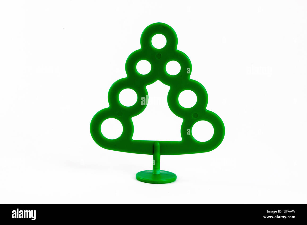 Green Plastic Christmas Tree isolated on white Stock Photo - Alamy