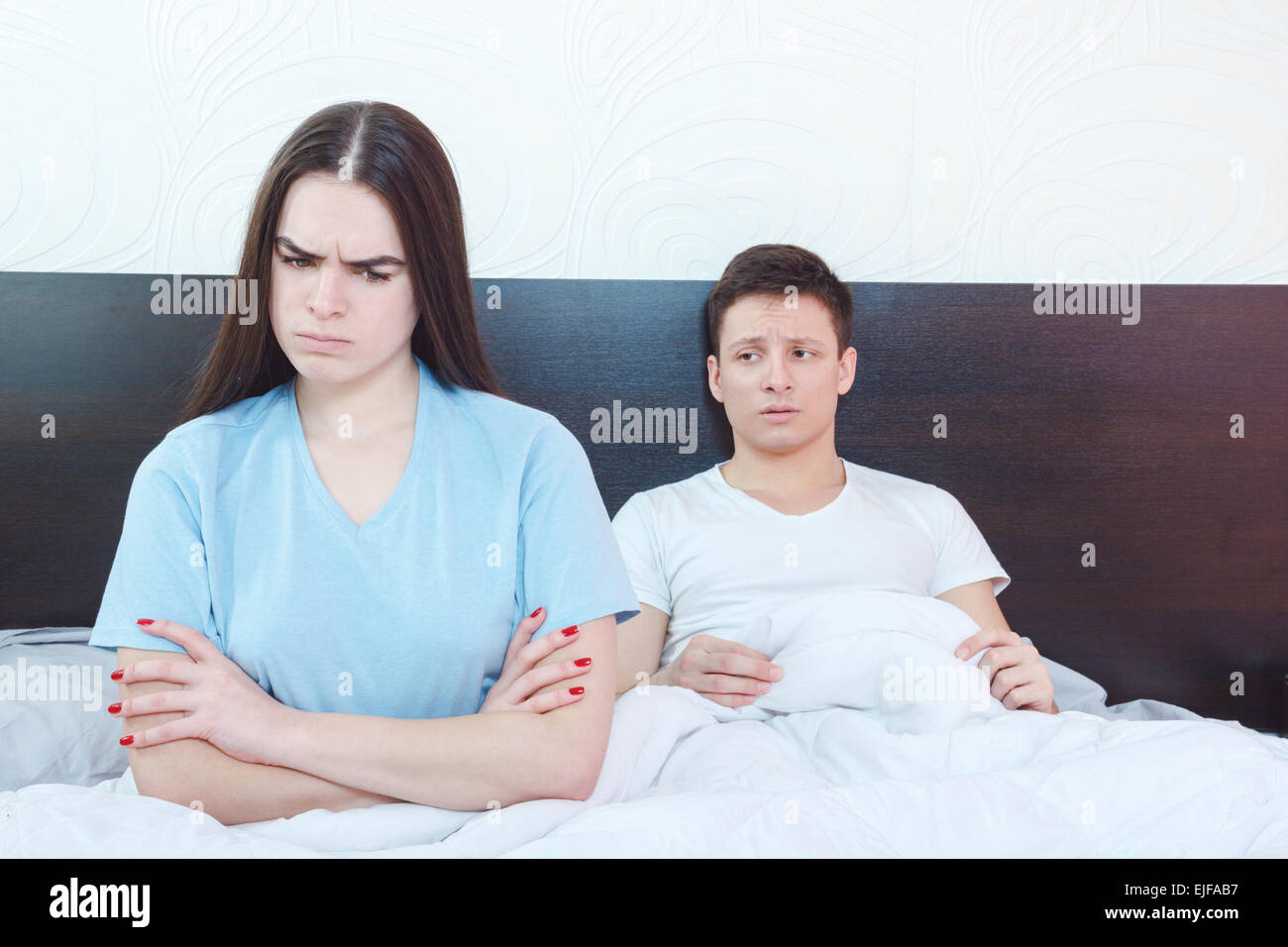 Grim dejected and emotionally hurt woman is angry while man in ...