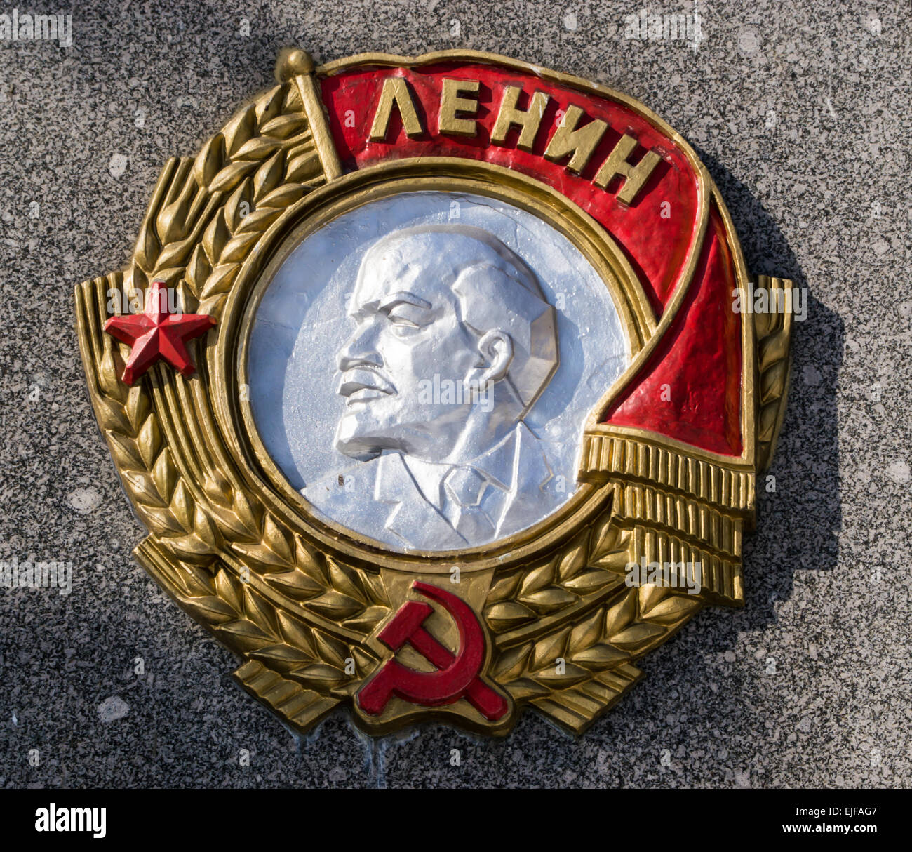 A silver gold and red stone emblem of Soviet Russia on stone Stock ...