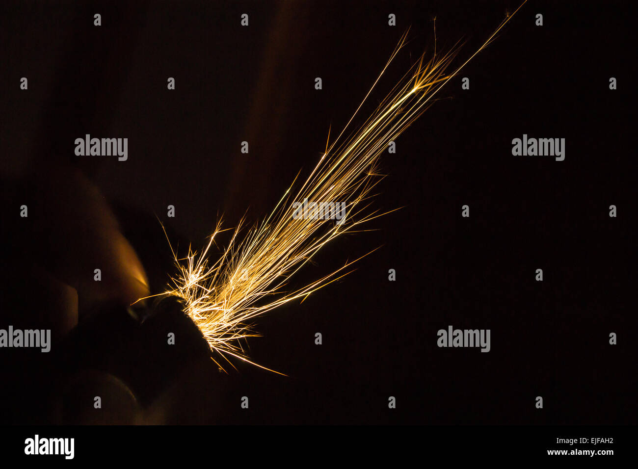 Sparks from a hand held lighter in the dark Stock Photo - Alamy