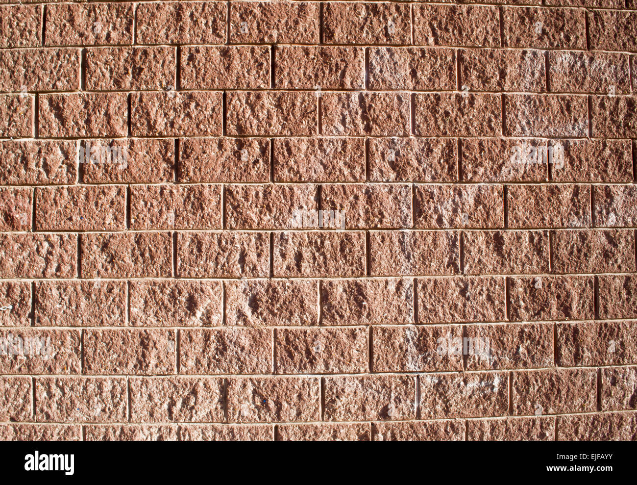 A old constructed brick wall built with cement and looking sturdy and ...