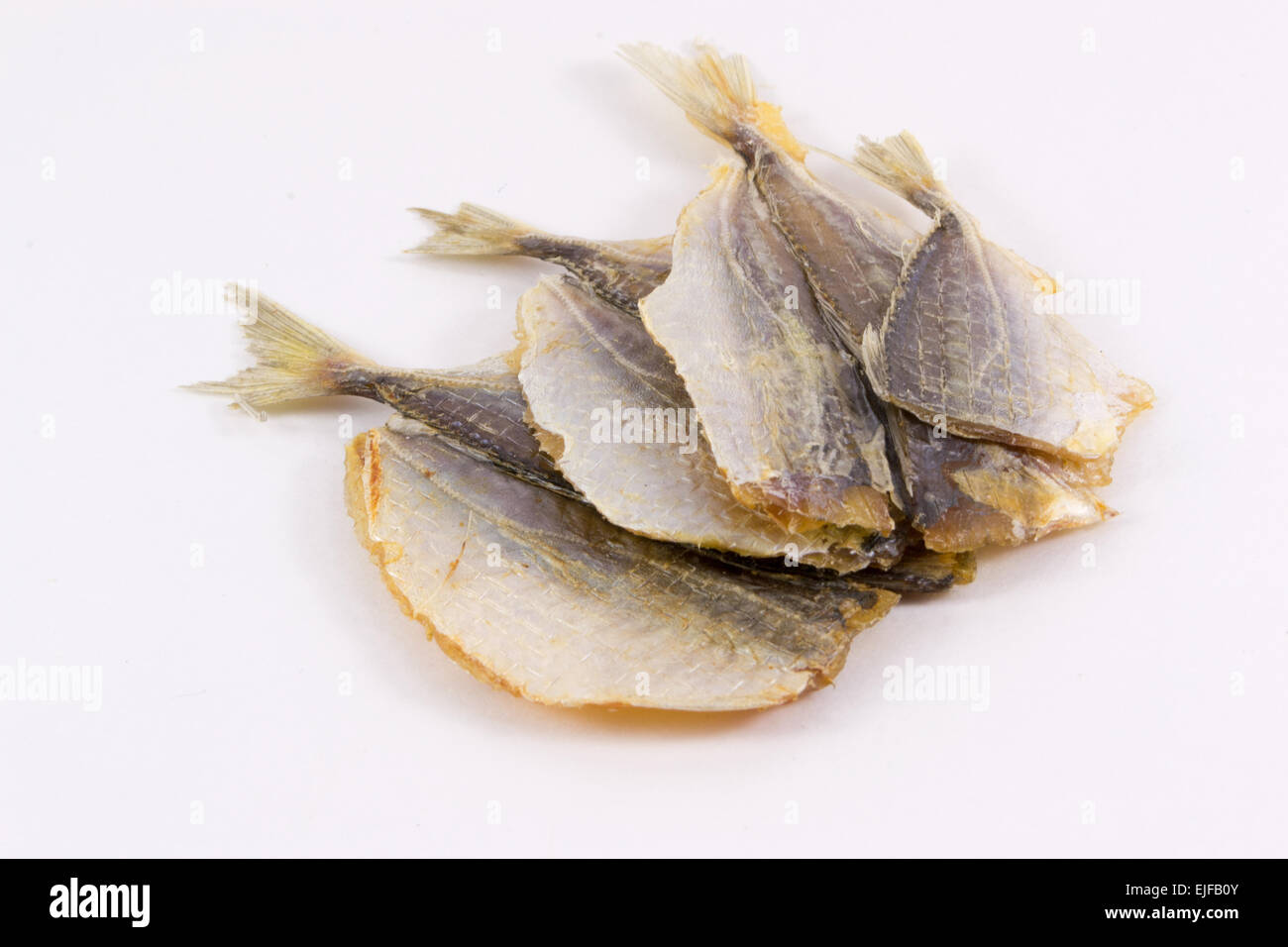 Traditional Russian beer snack of dried salted fish isolated on white ...