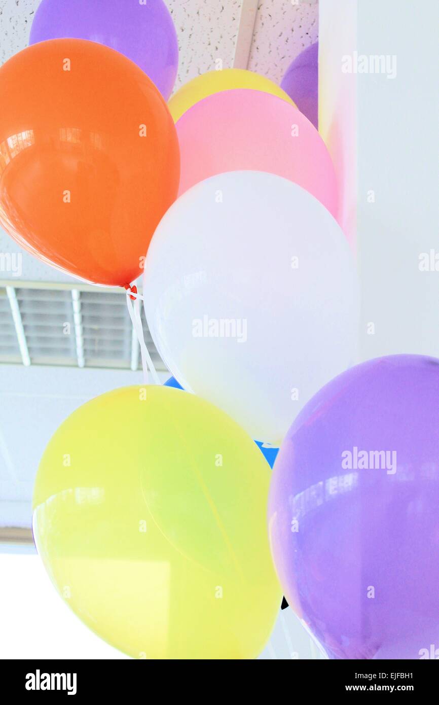 colorful balloons filled with helium Stock Photo - Alamy