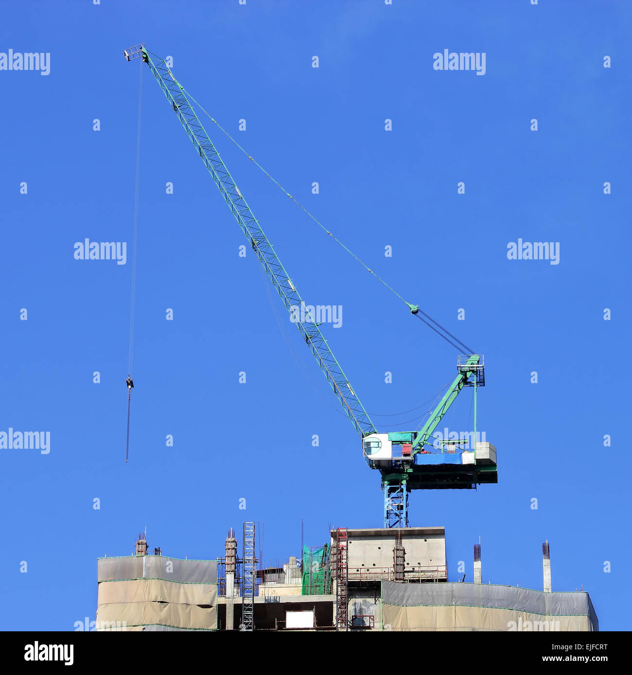 Working crane on construction site Stock Photo - Alamy