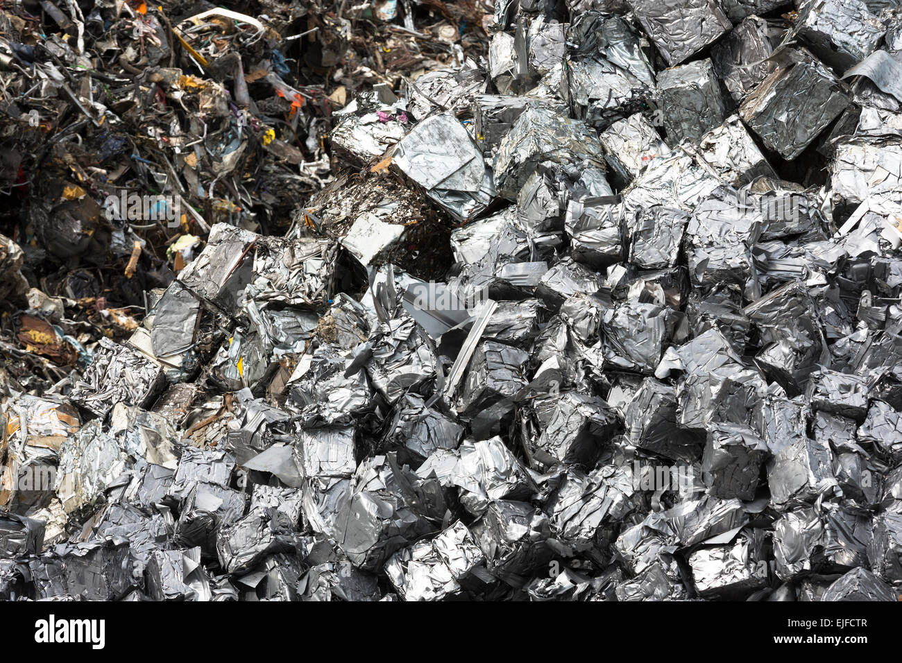 Metal recycling - scrap metal compacted into cubes - to avoid ...