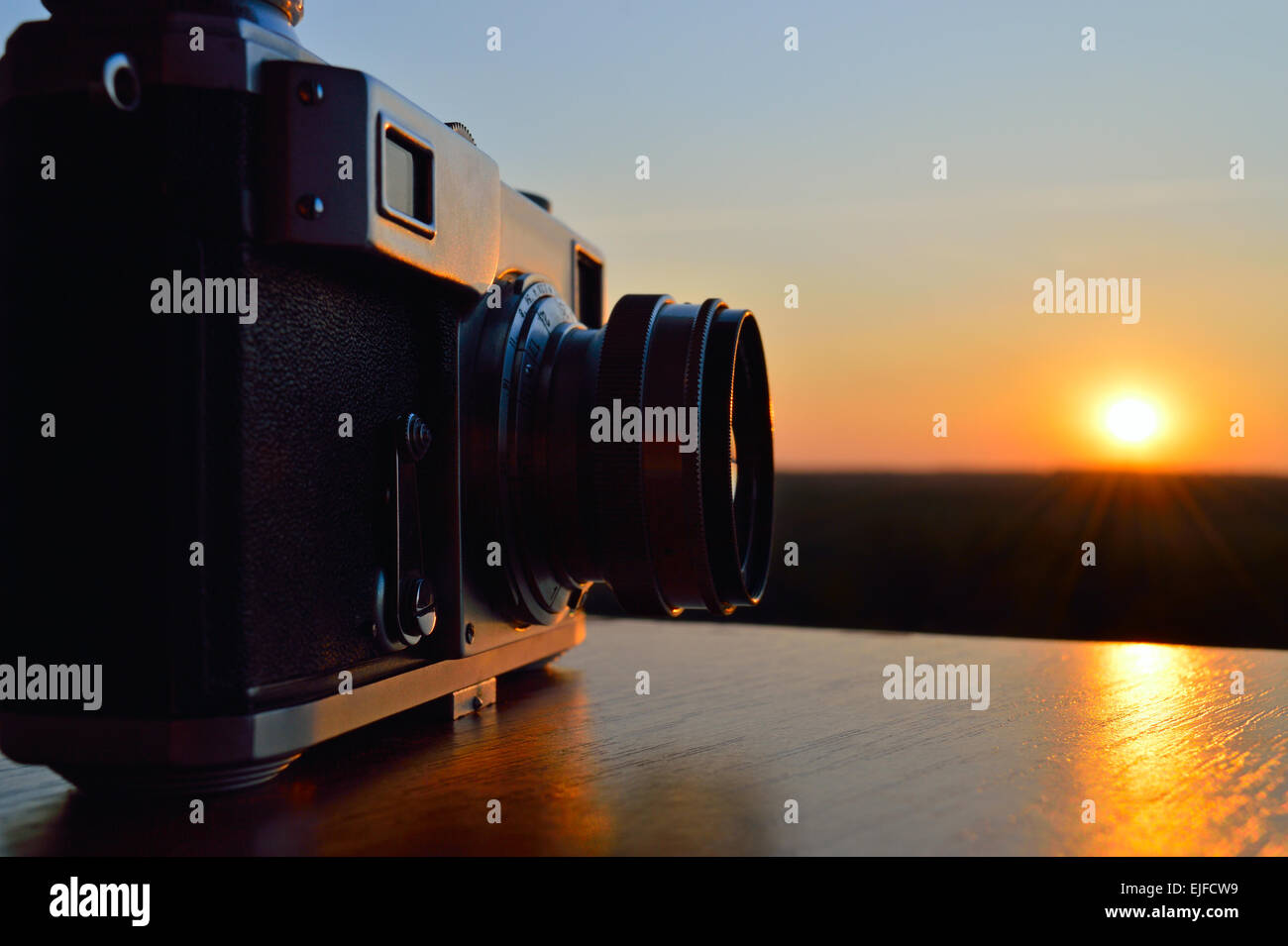 Old camera at sunset Stock Photo - Alamy