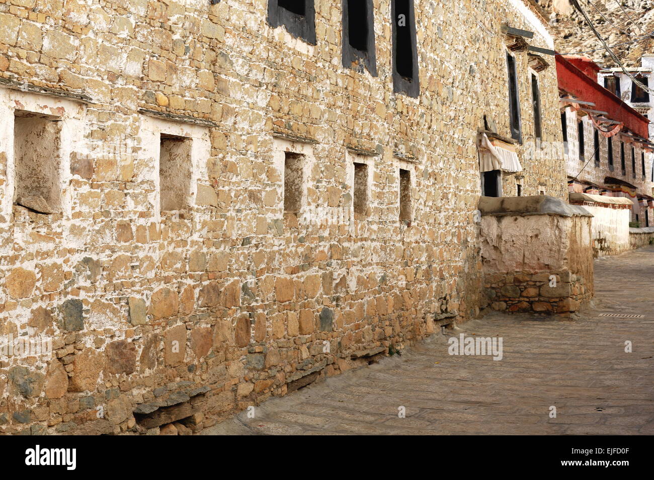 Cobbled passageway between stone buildings in the 1416 AD.founded ...