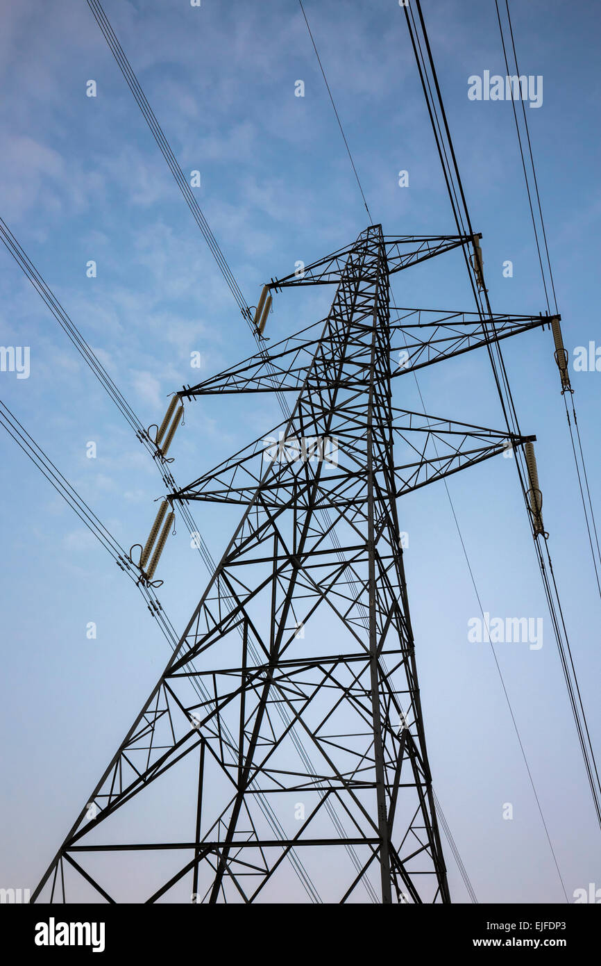 Electricity pylon and power cables close-up, a sculptural metal giant ...