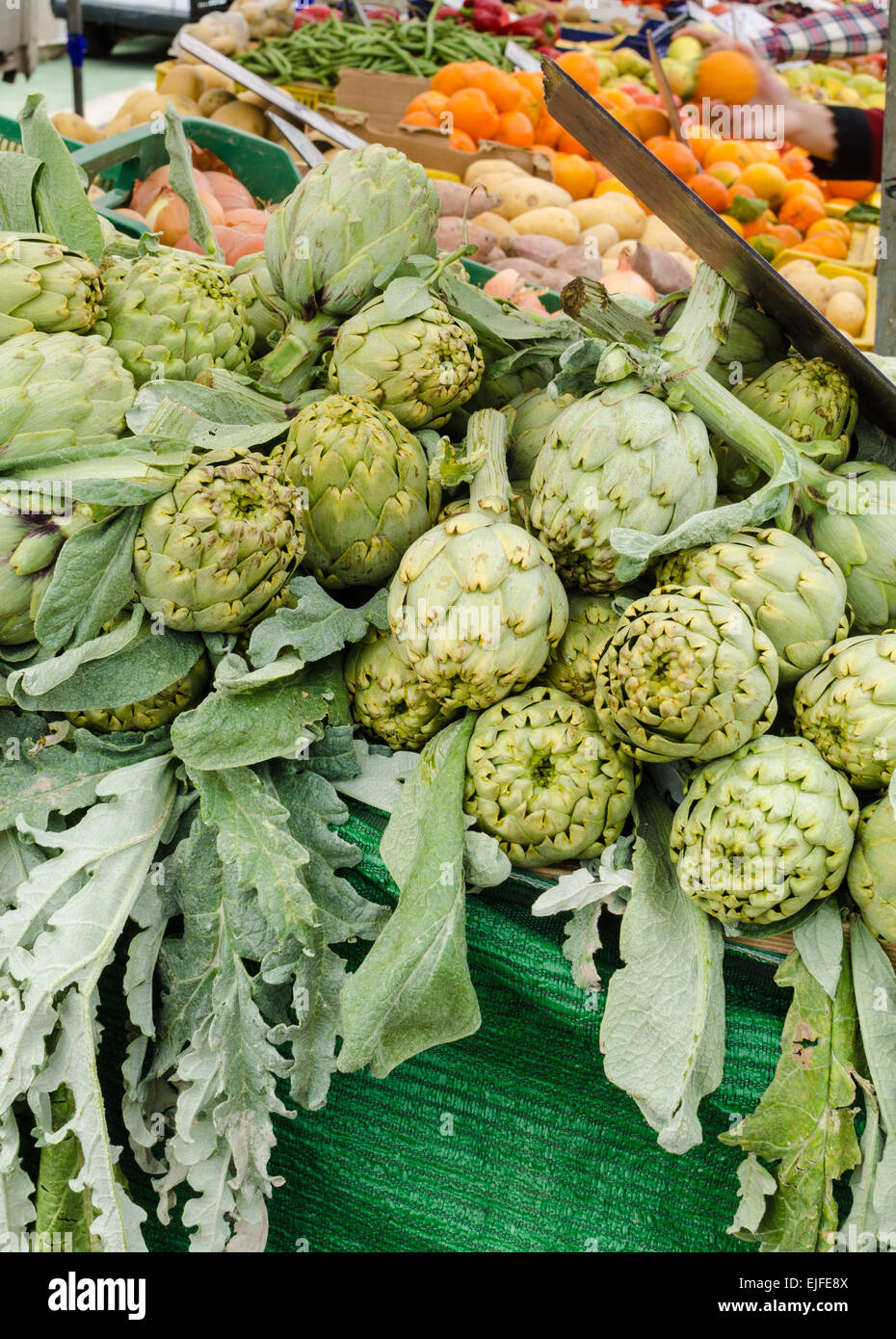 Assorted produce on a large street market stall Stock Photo - Alamy