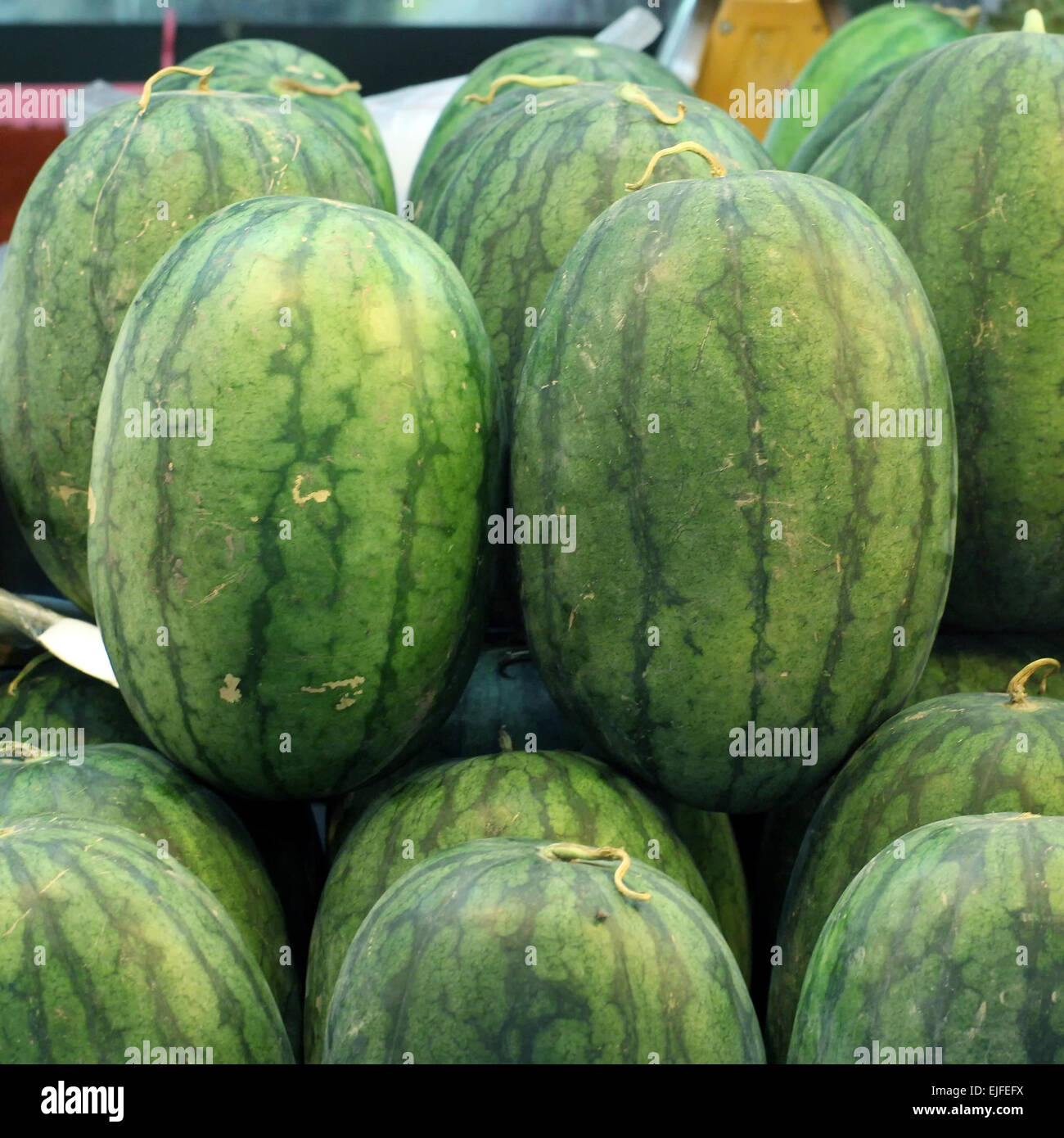 Pile of watermelon on market tray Stock Photo - Alamy