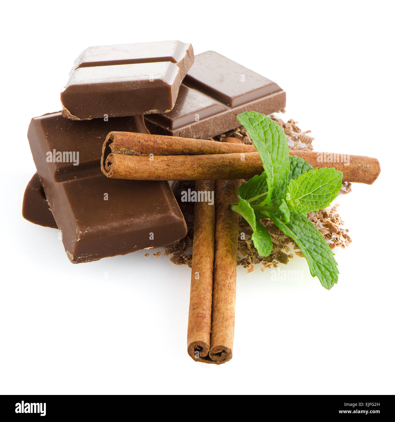 Closeup detail of chocolate parts and mint leaves on white background ...