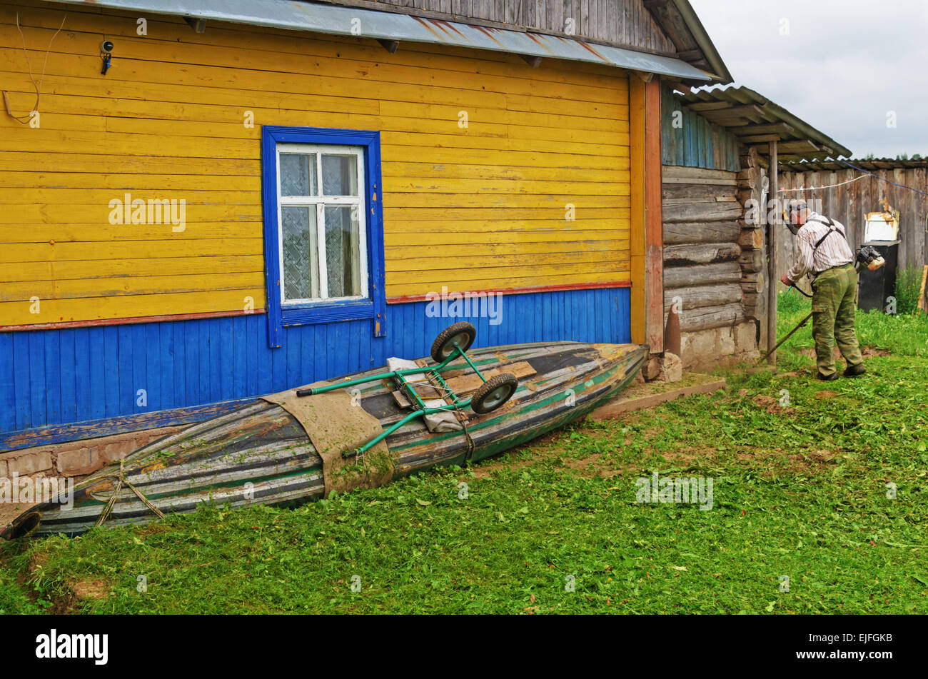Male farmer mows grass hi-res stock photography and images - Alamy