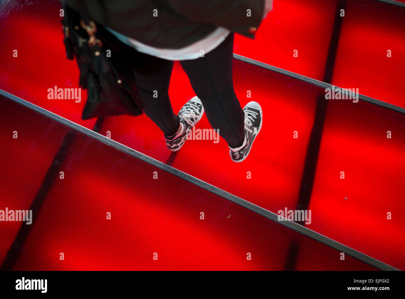 Person on the illuminated steps at Time Square, Manhattan, New York ...