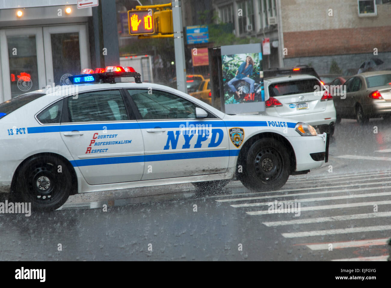 Police car on street in rain, Manhattan, New York City, New York State ...