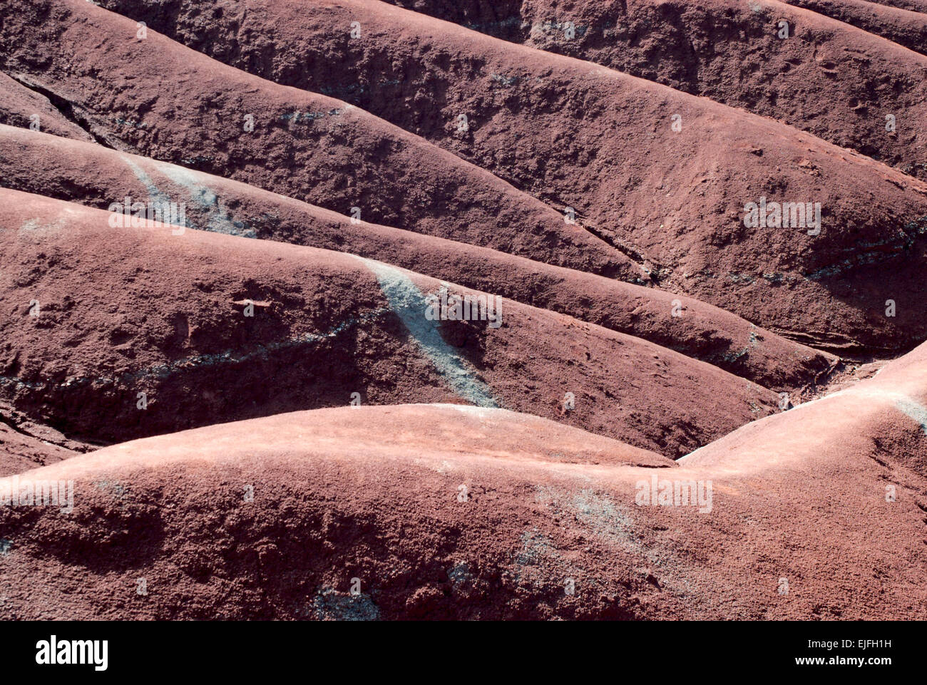 Red clay badlands dunes background texture Stock Photo - Alamy