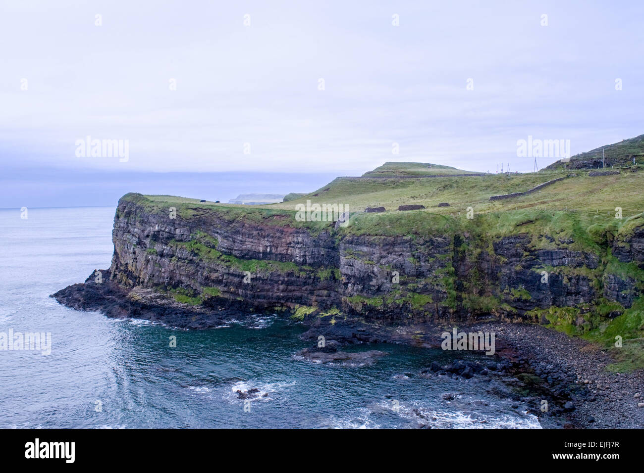 The rugged cliffs and a sharp drop to the ocean, scenic rural farmland ...