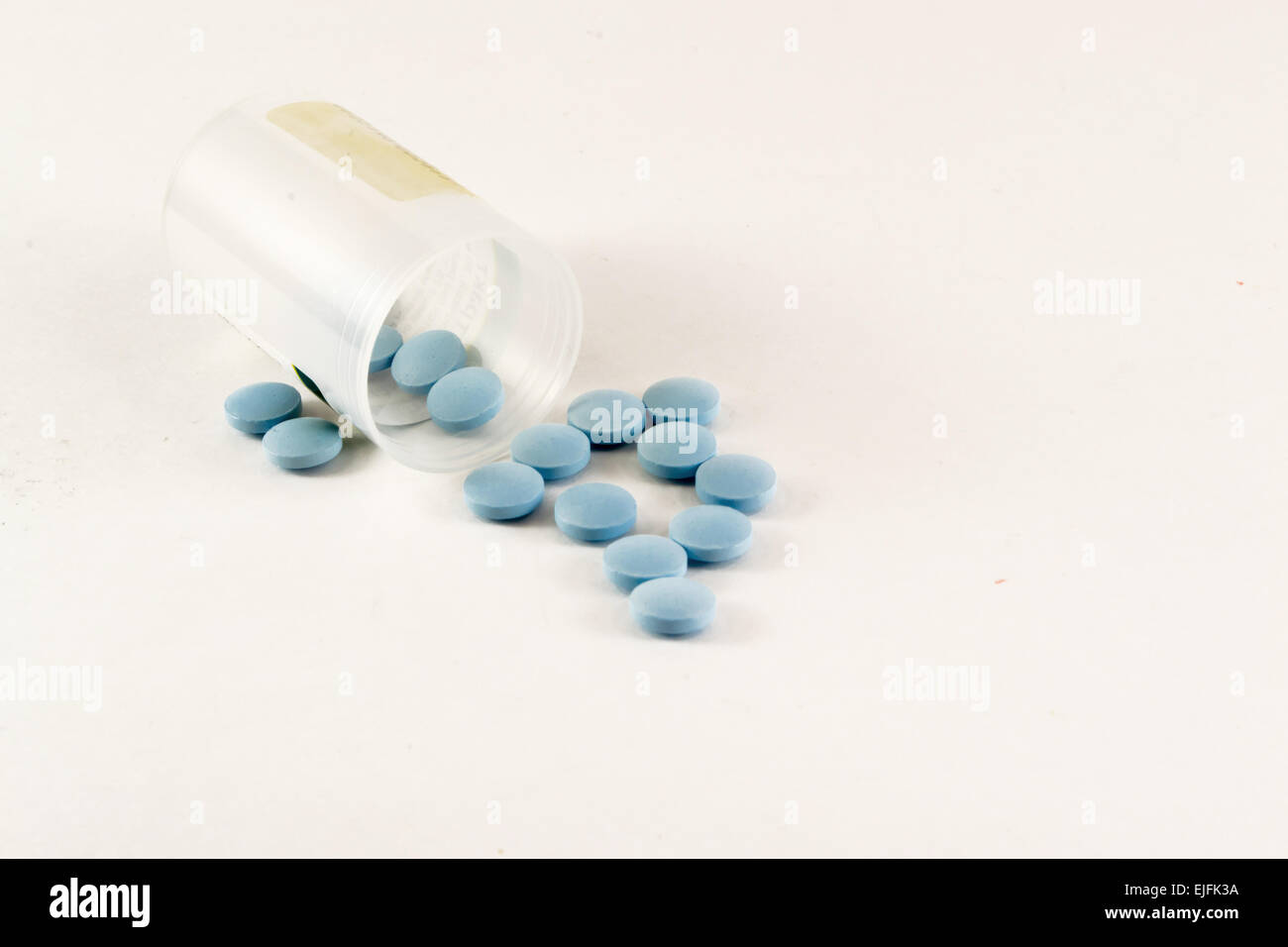Blue medicine pills on white isolated background Stock Photo - Alamy