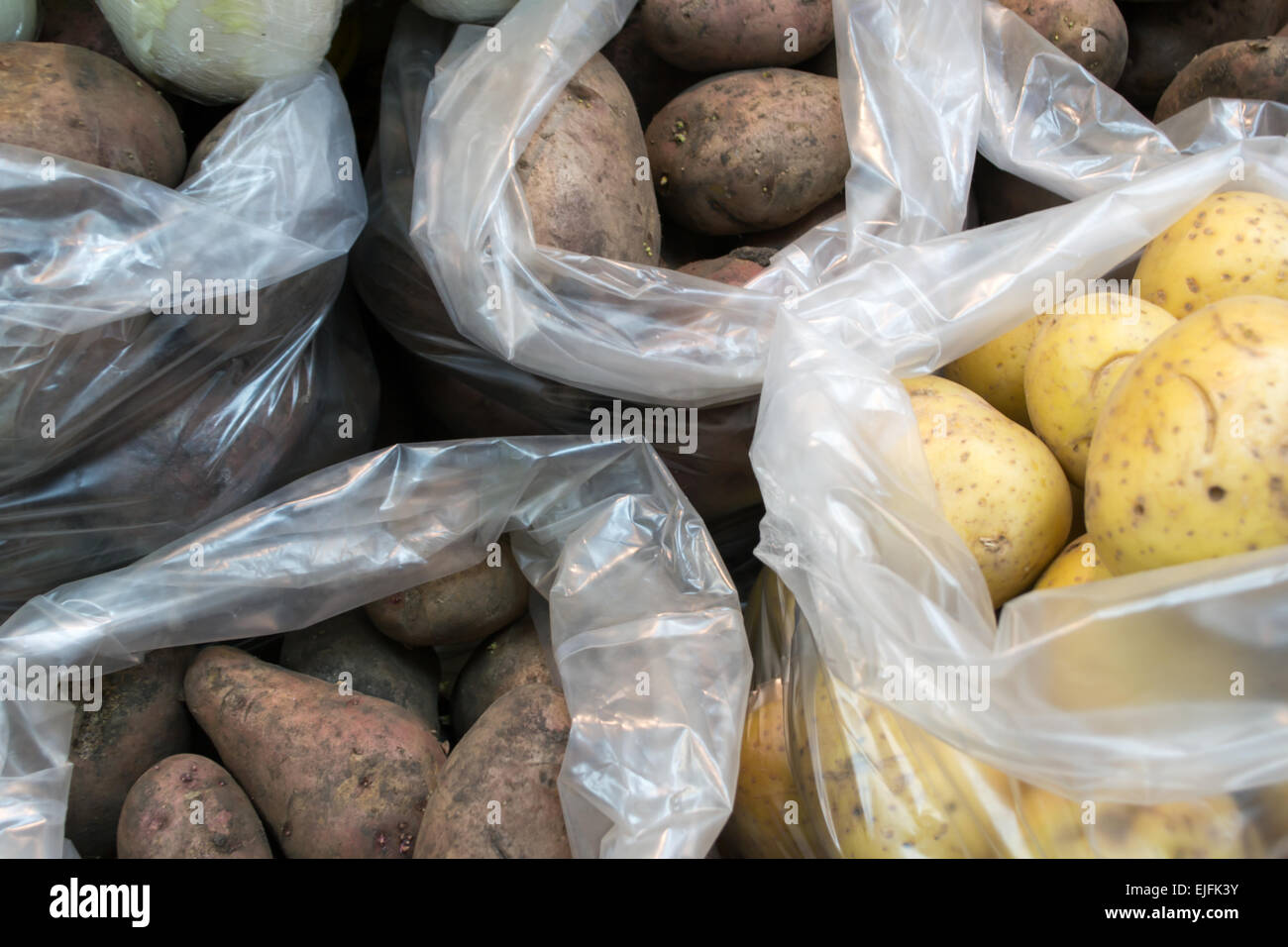 Bags of potatoes for sale at a local farmers market Stock Photo - Alamy