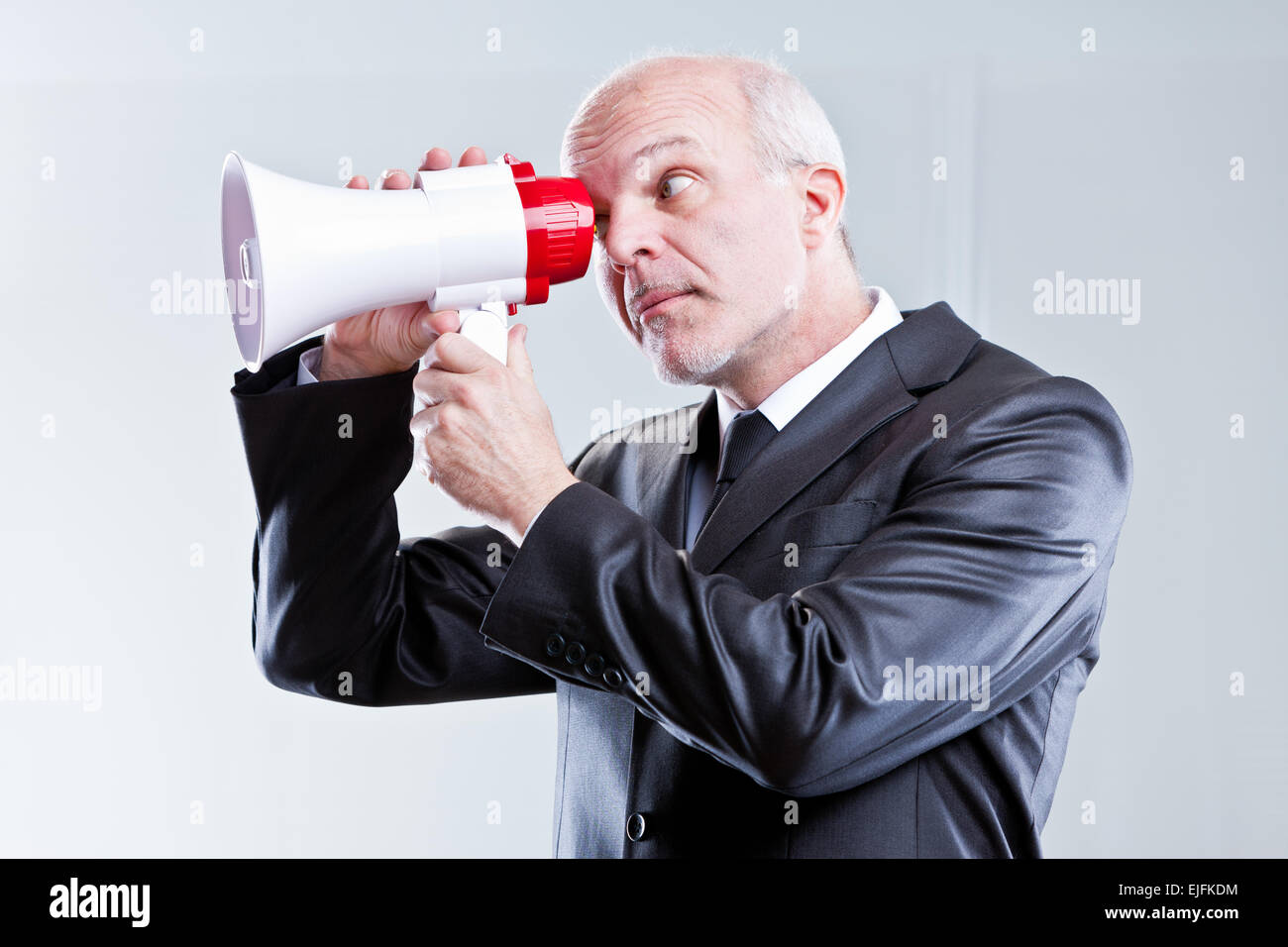 man using a megaphone in an unfitting way Stock Photo - Alamy