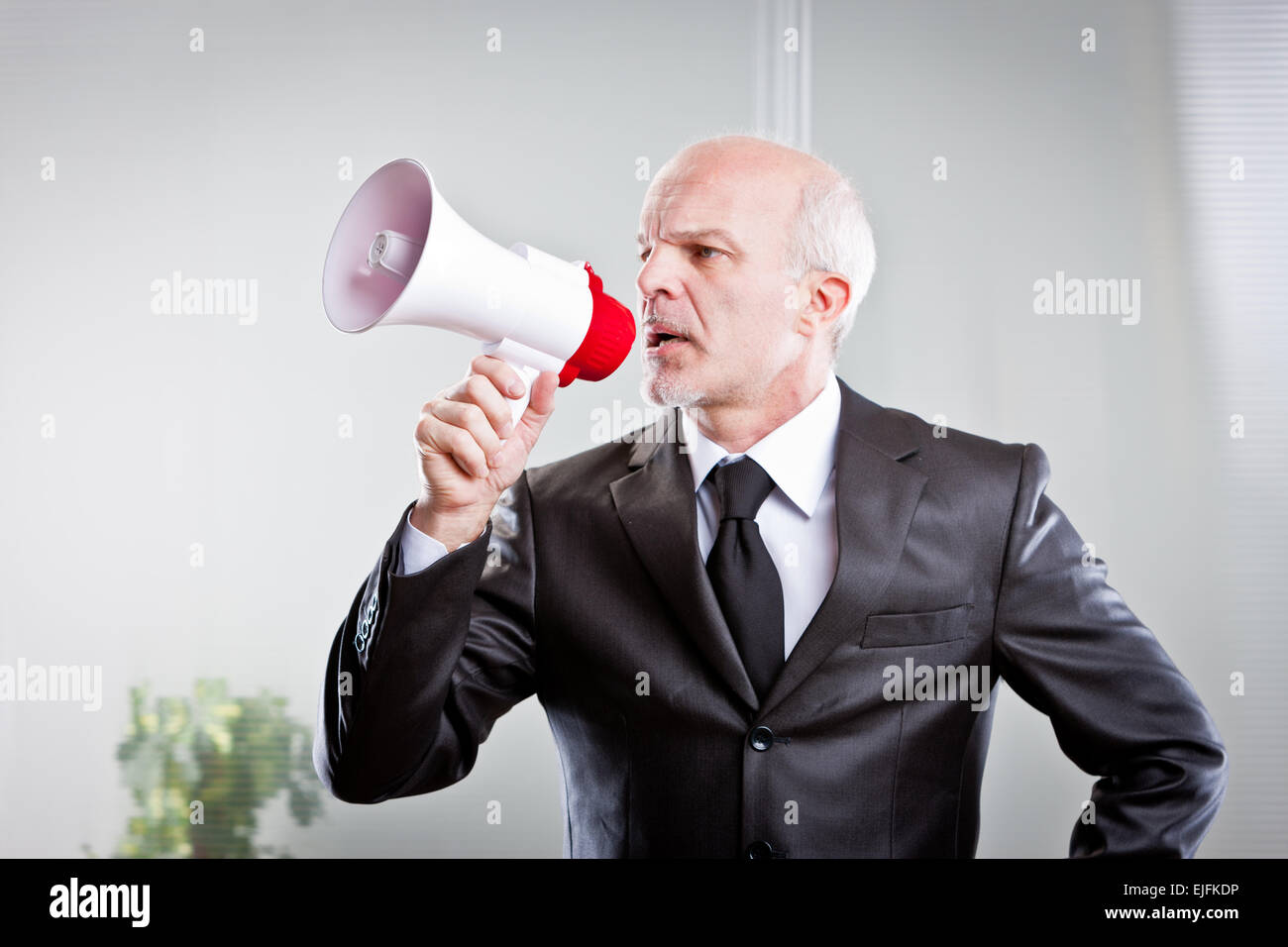 boss giving orders to his employees in a very bossy way Stock Photo - Alamy