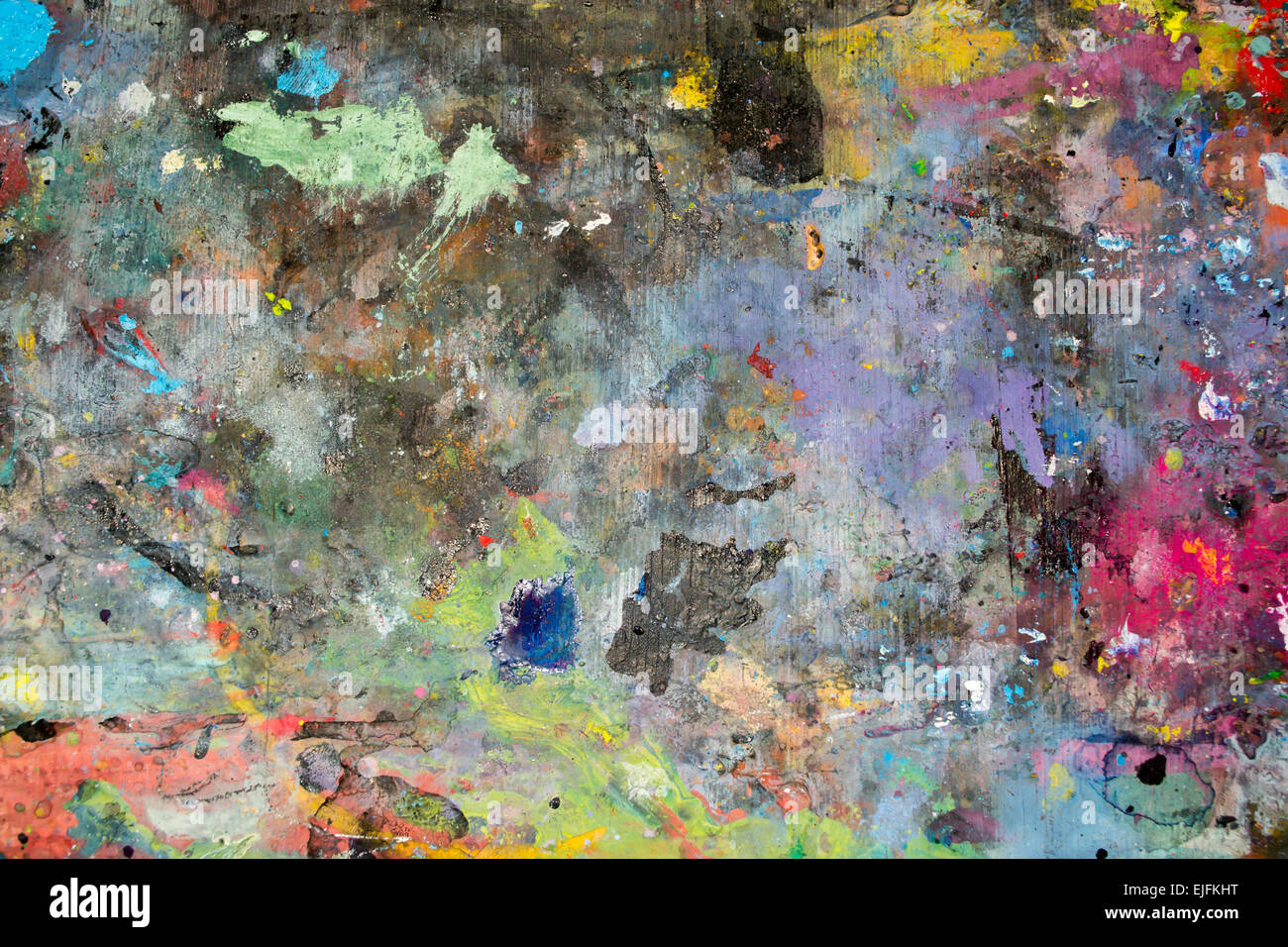 Close up paint texture and detail from an artist’s multicoloured ...