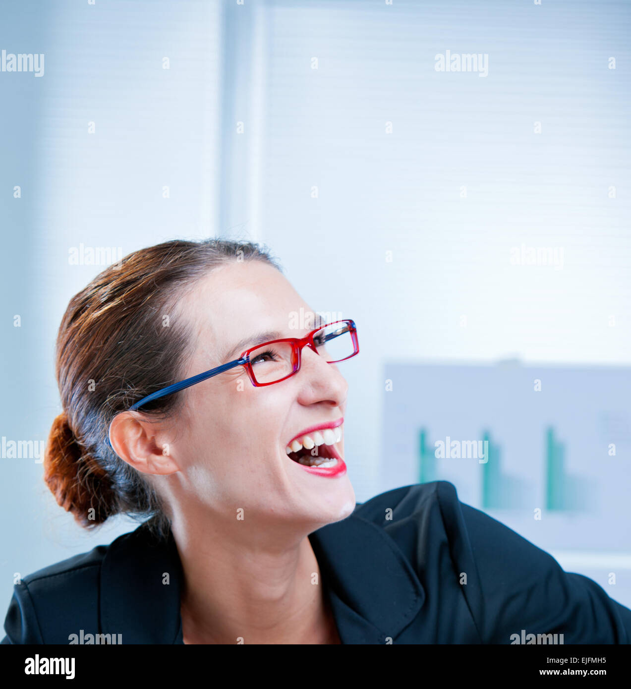 happy slim businesswoman laughing with open mouth Stock Photo - Alamy