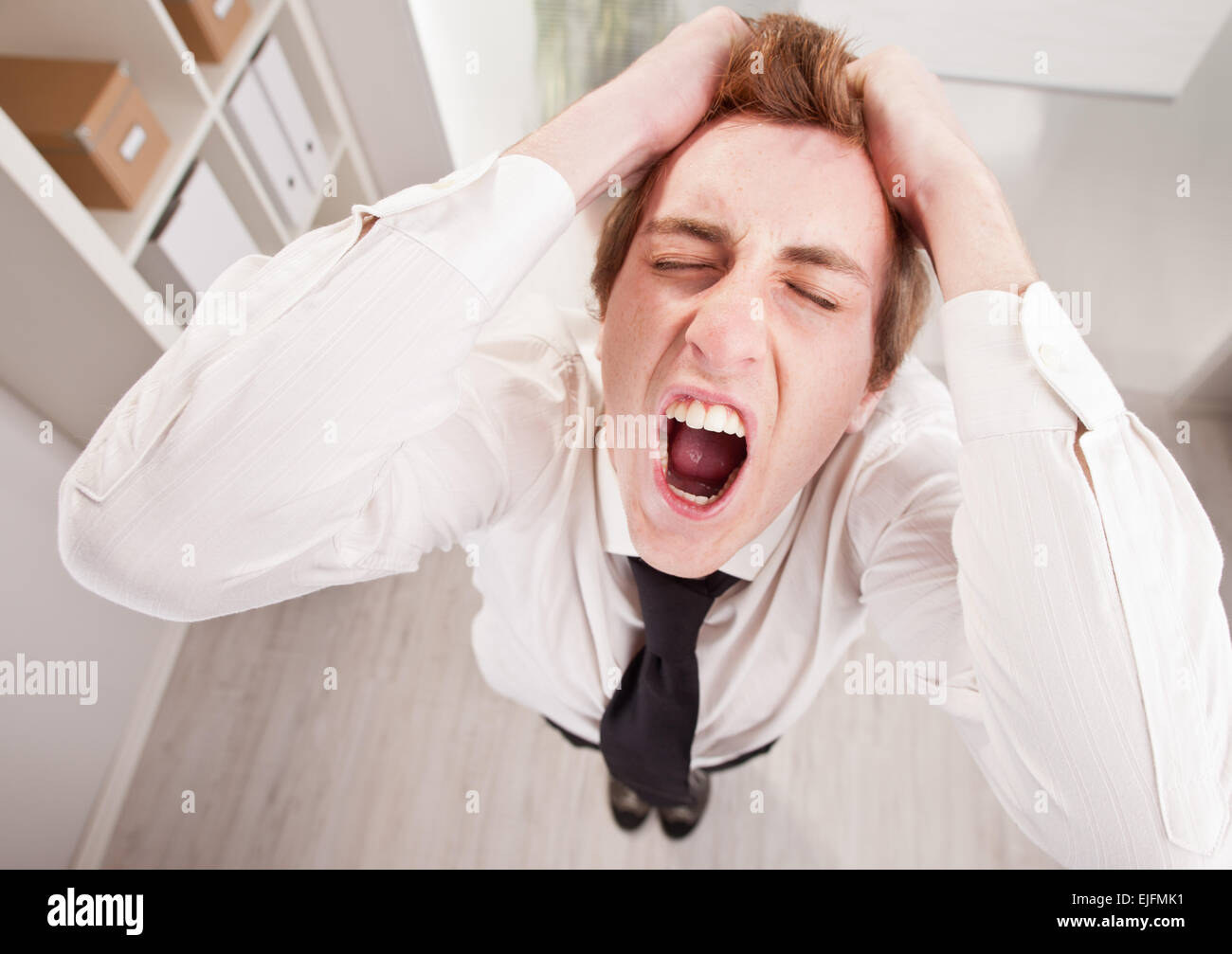 angry clerk in wide angle shouting Stock Photo - Alamy