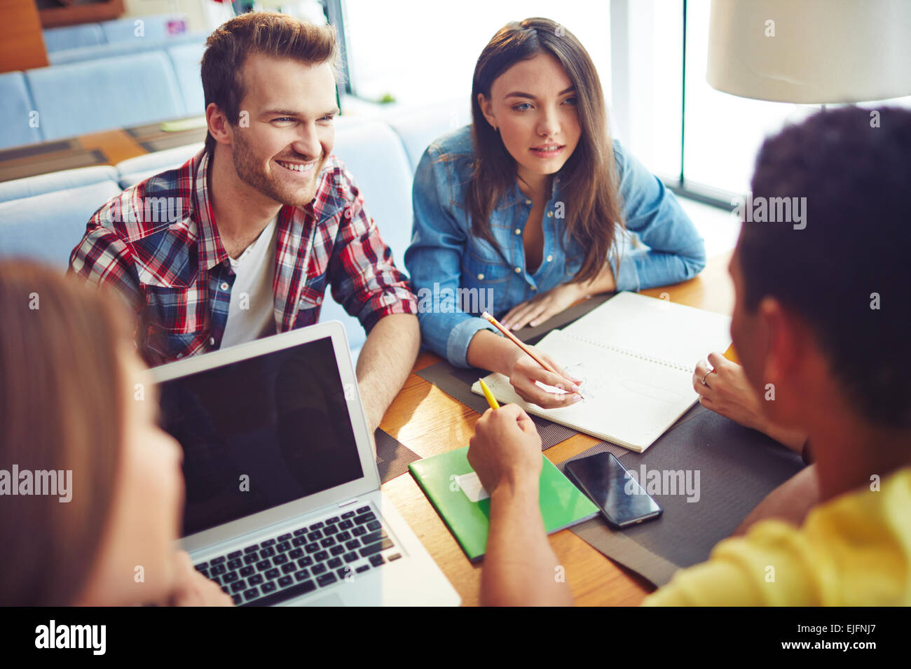 Group of people discussing some issues Stock Photo - Alamy