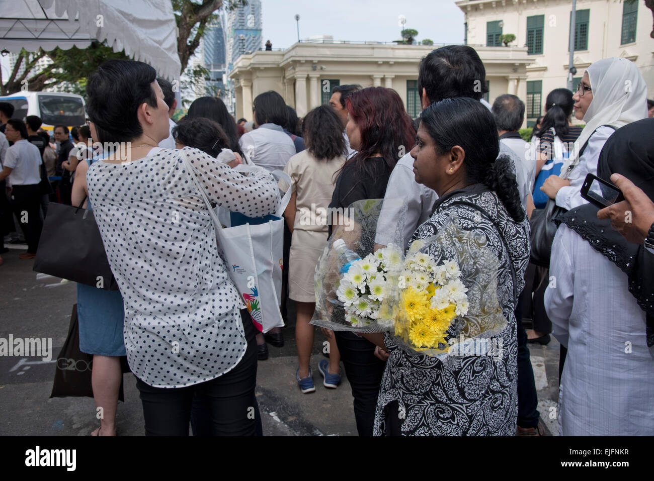 A huge queue has formed in central Singapore as thousands wait to pay ...