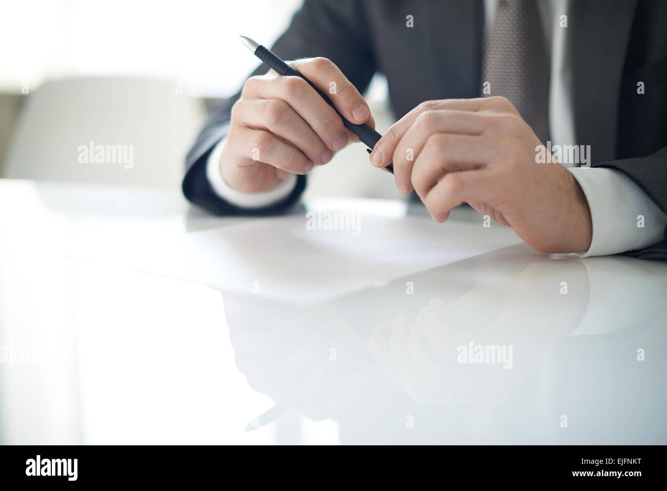 Man holding pen in his hands Stock Photo - Alamy