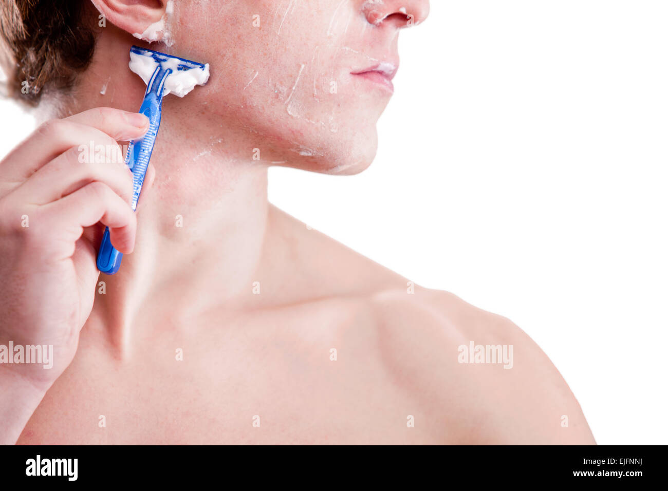 profile of a young man shaving with a blue razor Stock Photo - Alamy