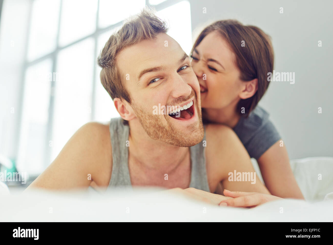 Woman flirting in bed hi-res stock photography and images - Alamy