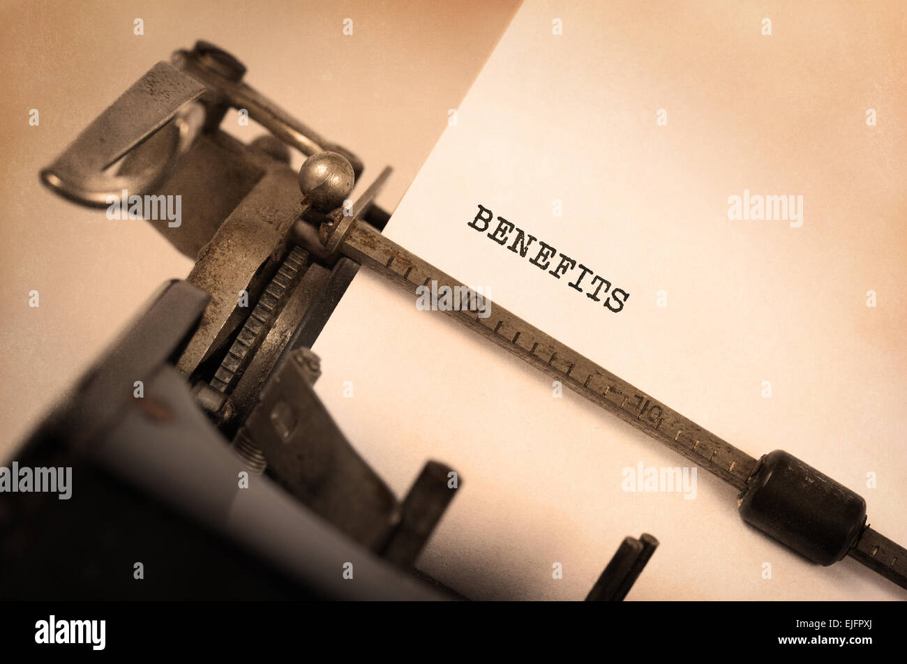 Vintage inscription made by old typewriter, benefits Stock Photo - Alamy