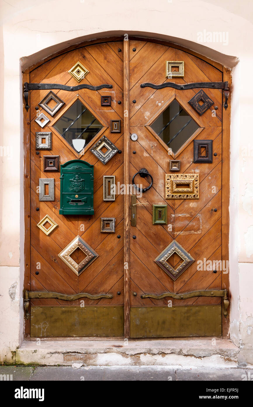 Vertical oriented picture of wooden shop doors decorated with a set of ...