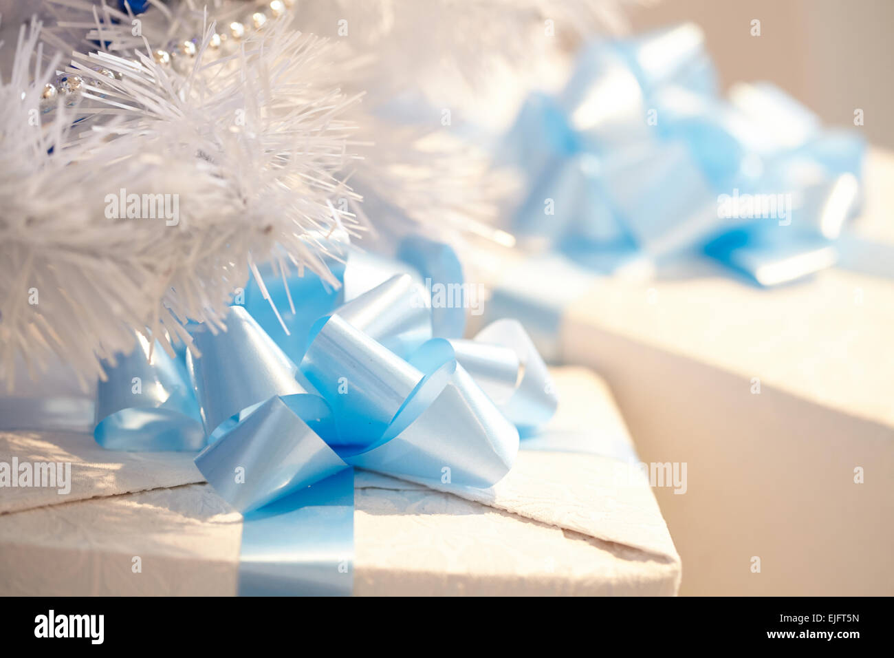 blue box with a white bow for Christmas Stock Photo - Alamy