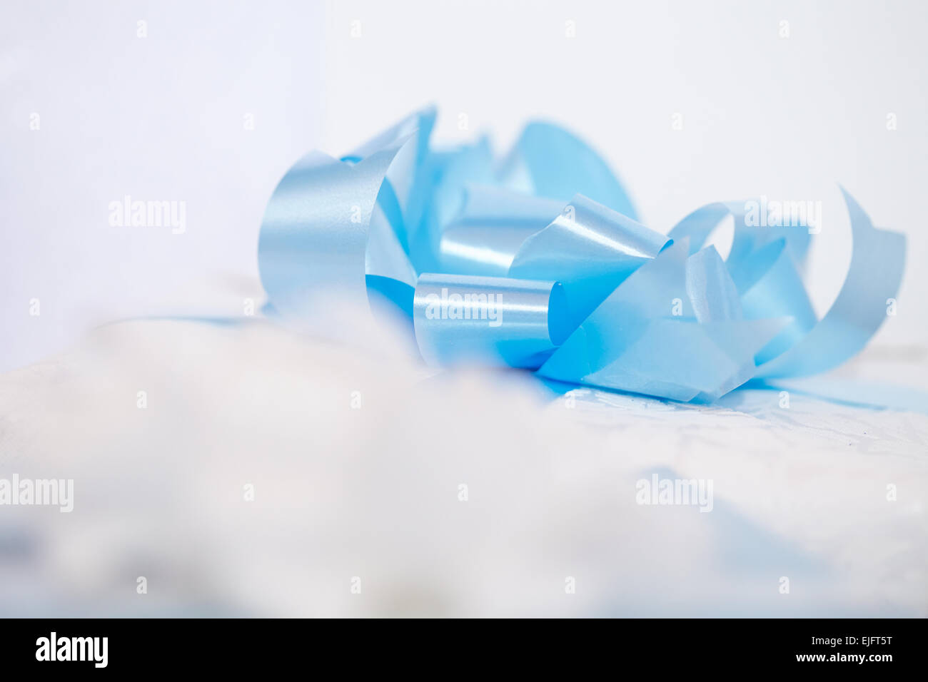 blue box with a white bow for Christmas Stock Photo - Alamy