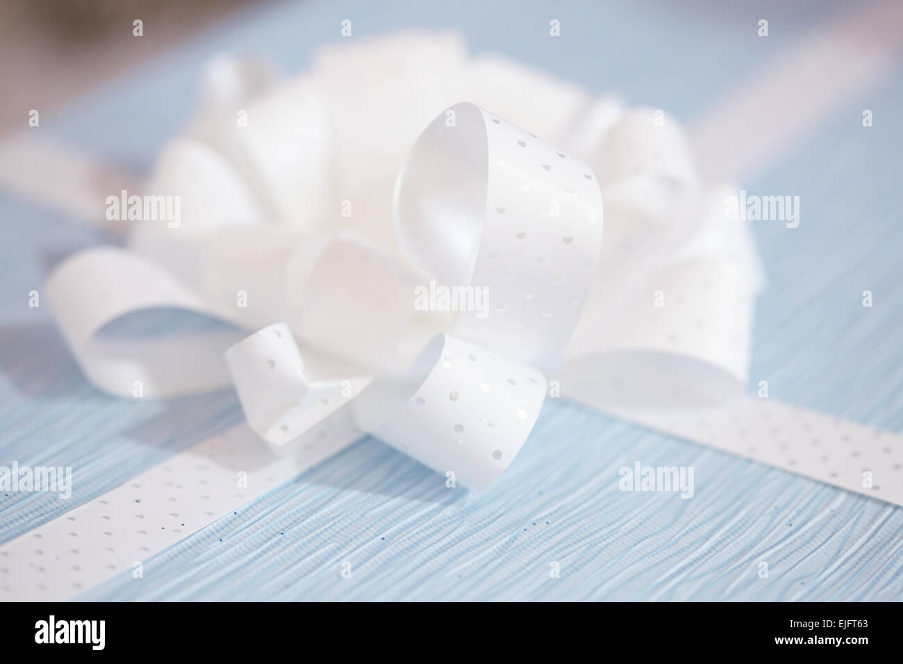 blue box with a white bow for Christmas Stock Photo - Alamy