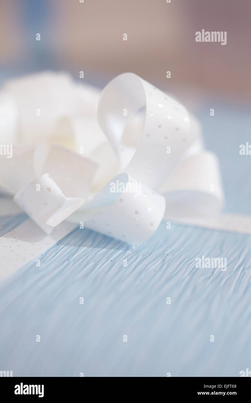 blue box with a white bow for Christmas Stock Photo - Alamy