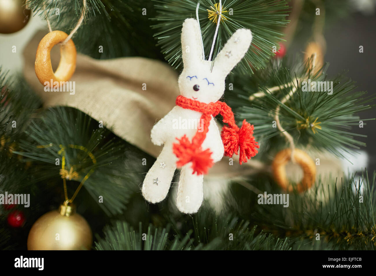 little rabbit hanging on a Christmas tree Stock Photo - Alamy